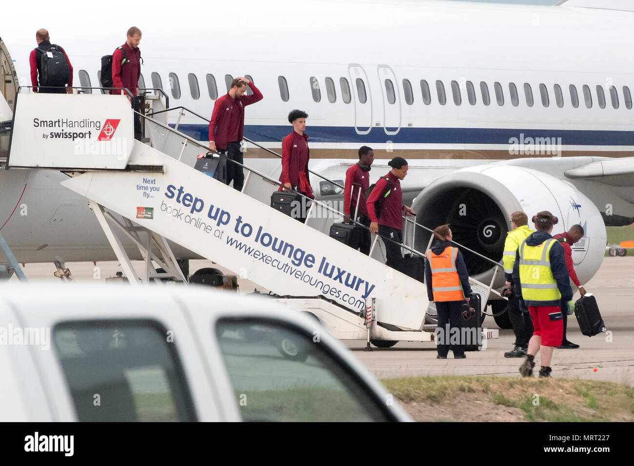 Liverpool players get off the plane at John Lennon Airport after defeat ...