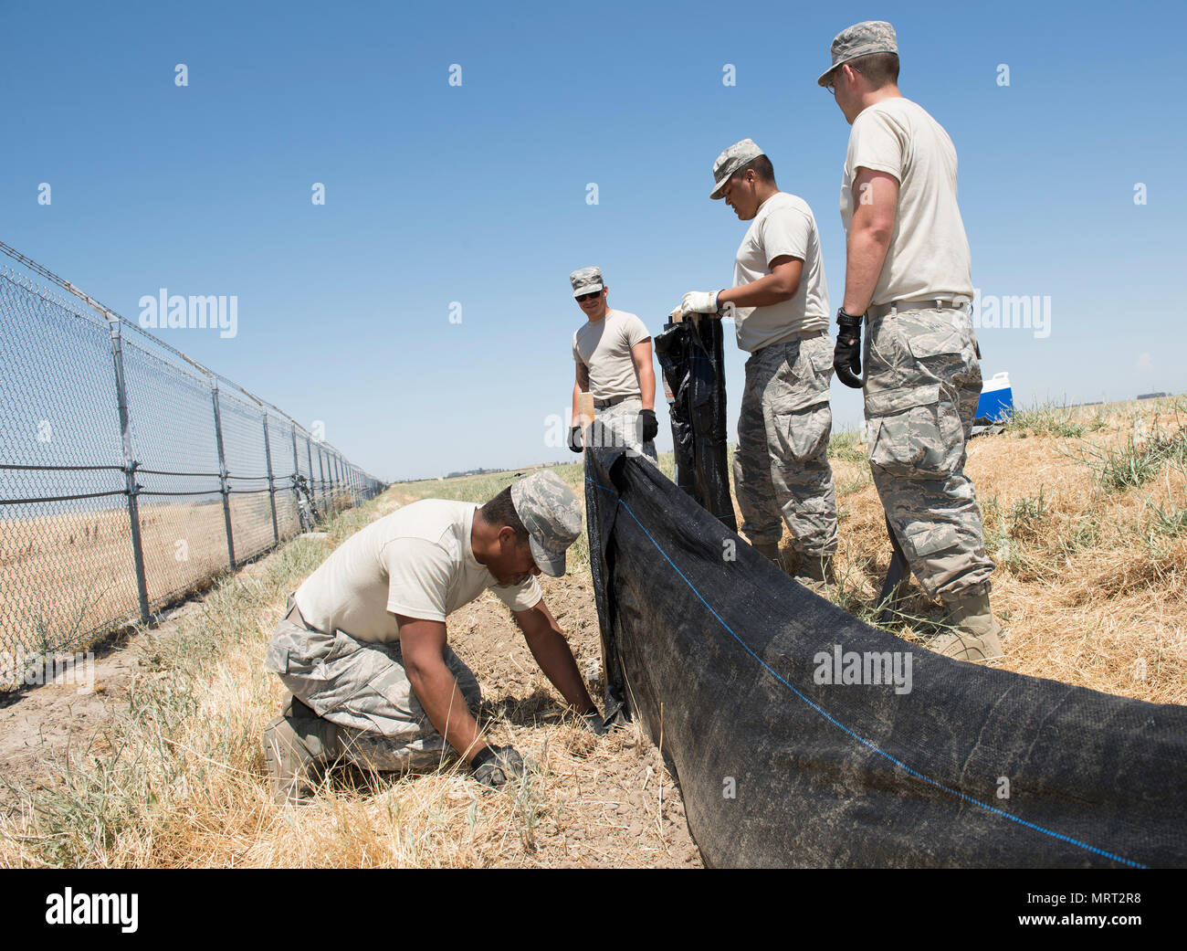 As temperatures exceed 100 degrees Fahrenheit, Airmen from the 60th ...