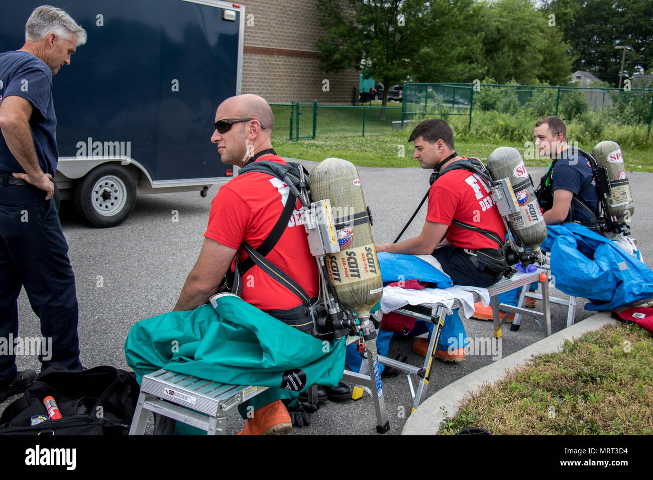Firefighters with oxygen tanks hi-res stock photography and images - Alamy