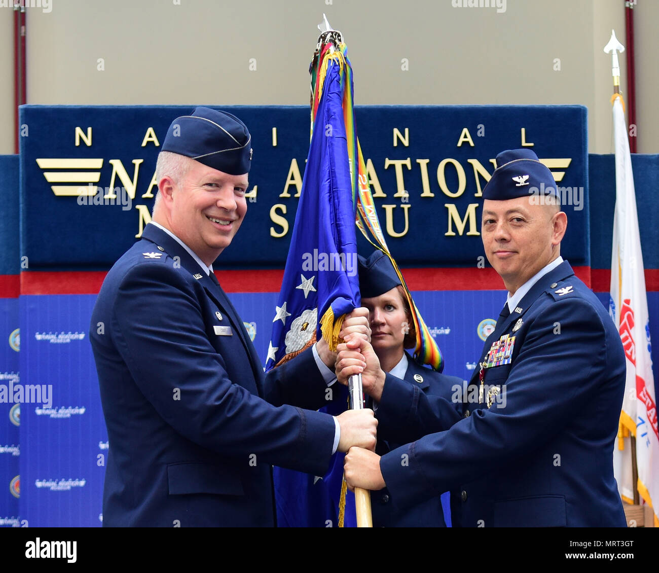 Col. Joel Carey, 12th Flying Training Wing commander, receives the guidon from Col. John Edwards ...
