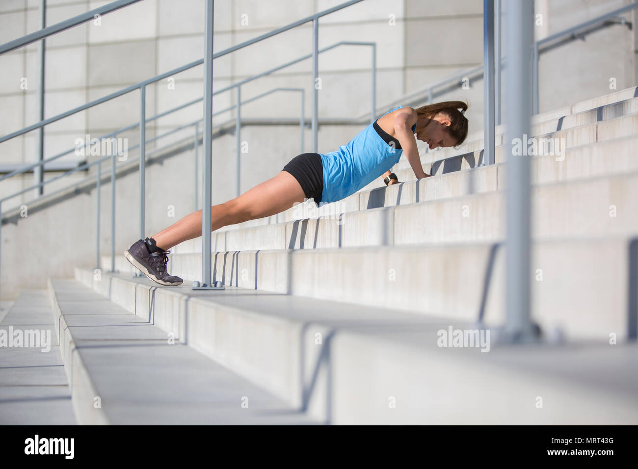 Athlete woman doing pushups Stock Photo - Alamy