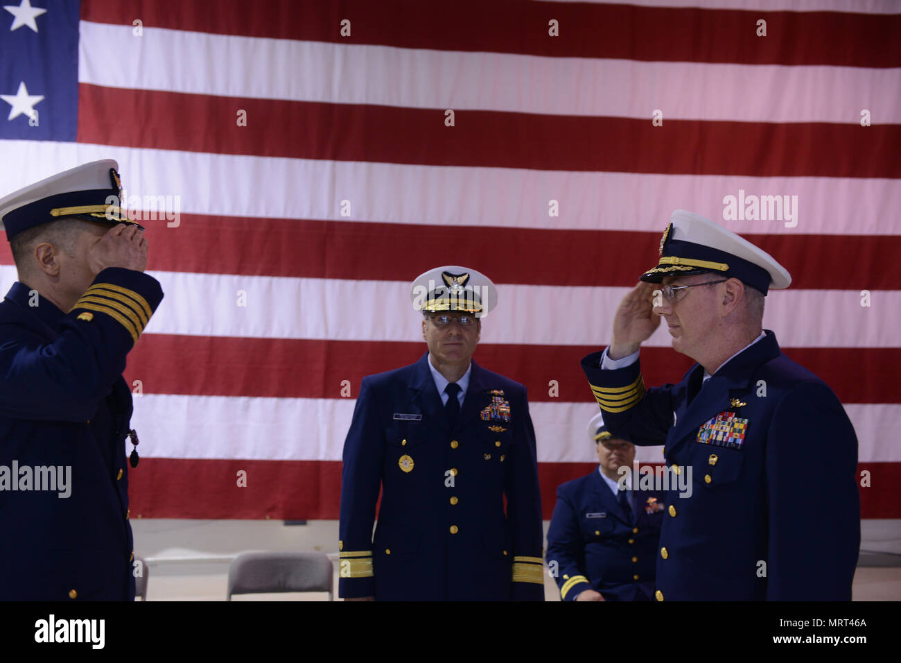 Capt. Sean Mackenzie (right) relieves Capt. Paul Albertson as commander ...