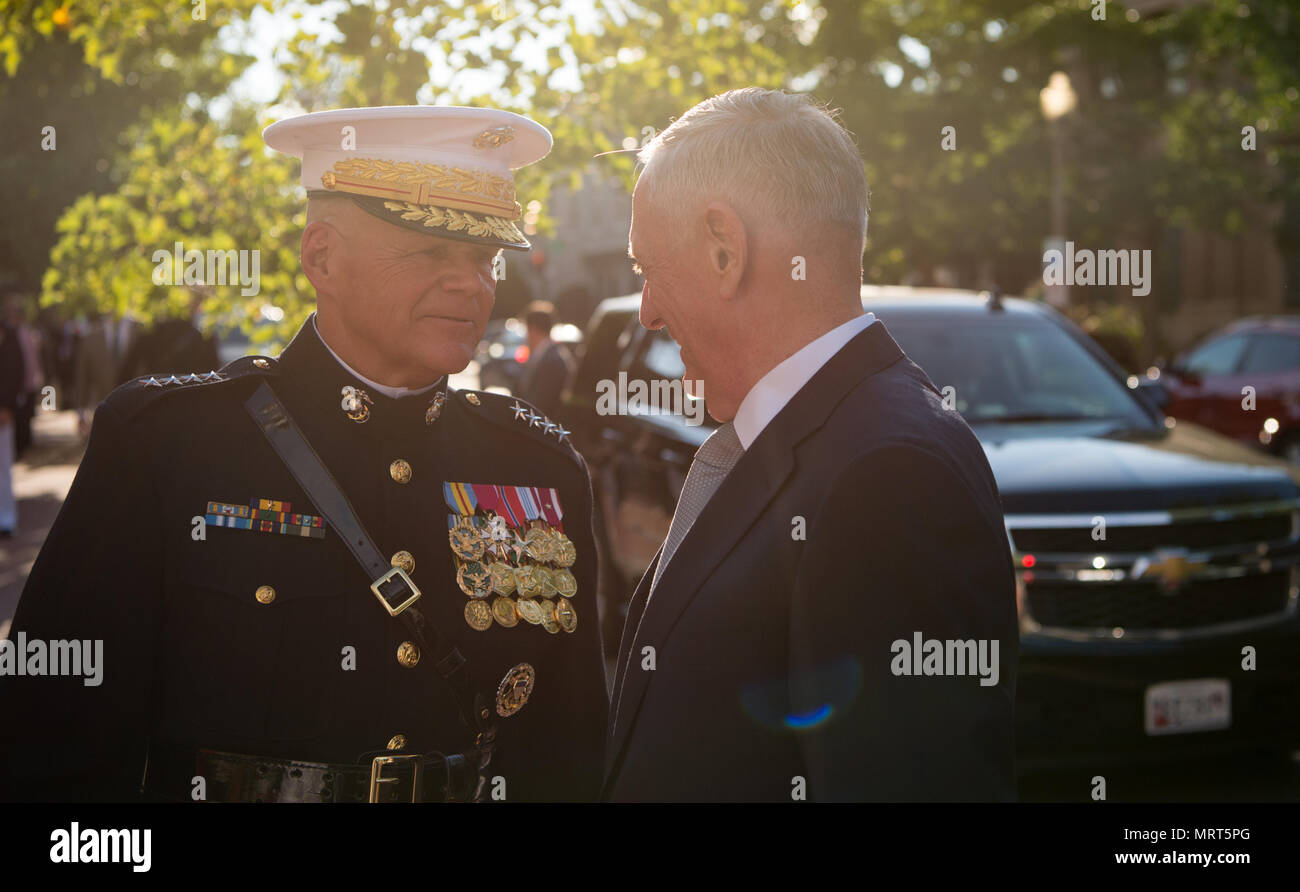 Secretary of Defense Jim Mattis speaks with the Commandant of the ...