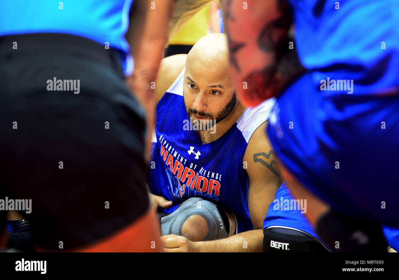 Members of Team Air Force gather for a huddle during a sitting ...