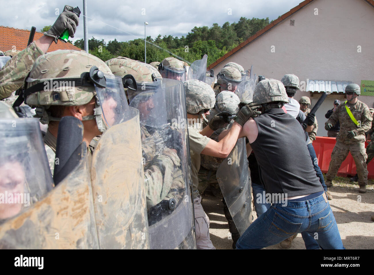 U.S. Soldiers, left, of 82nd Airborne Division repel simulated hostile ...