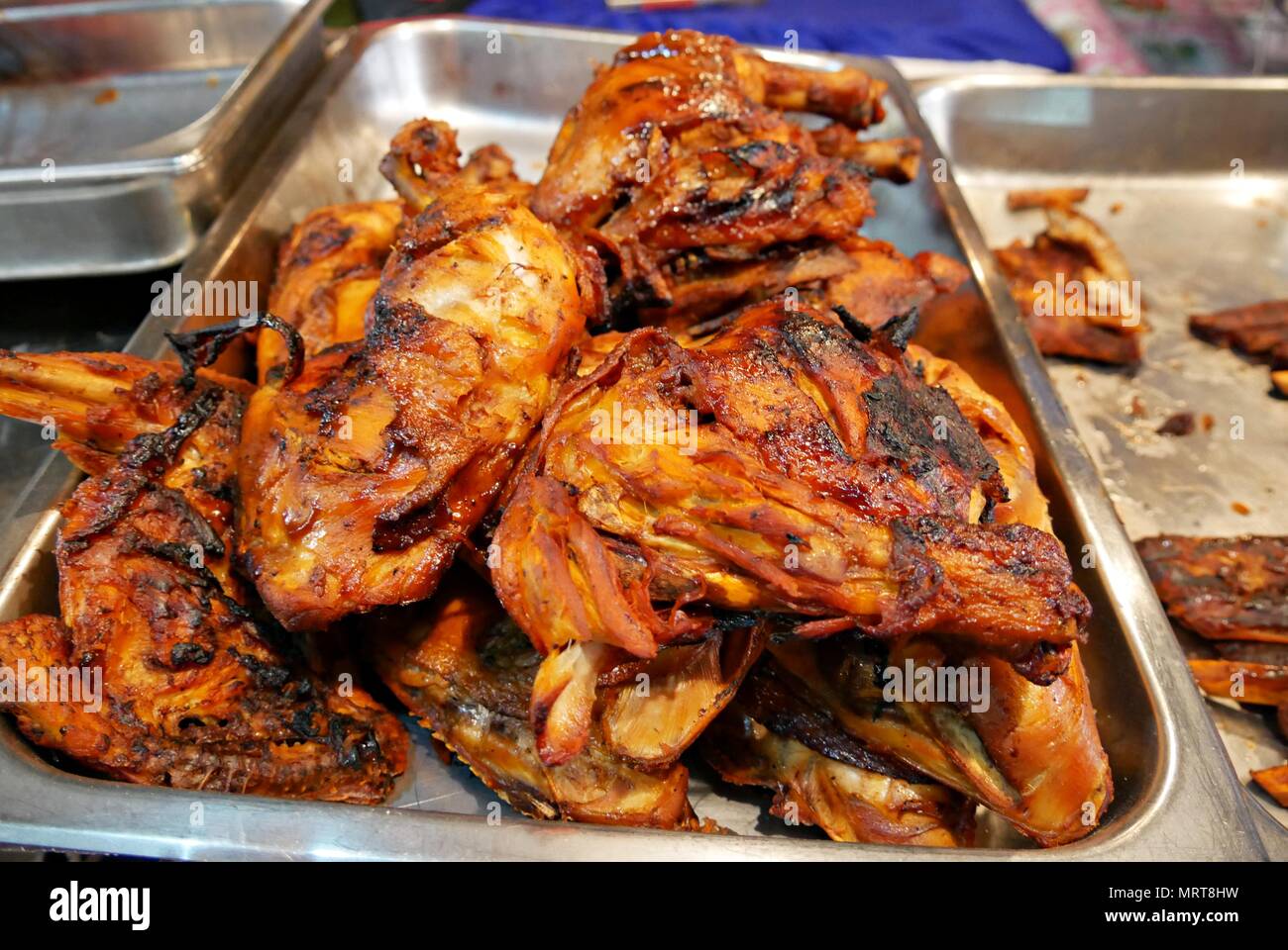 Delicious grilled chicken meat is a popular and traditional street food ...