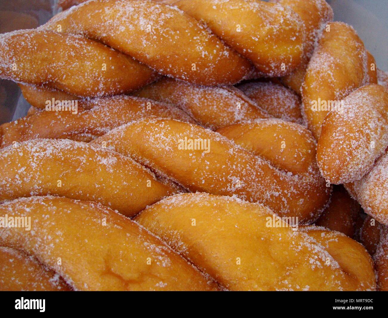 Shakoy or “pilipit” is a twisted fried donut coated with sugar and is a ...