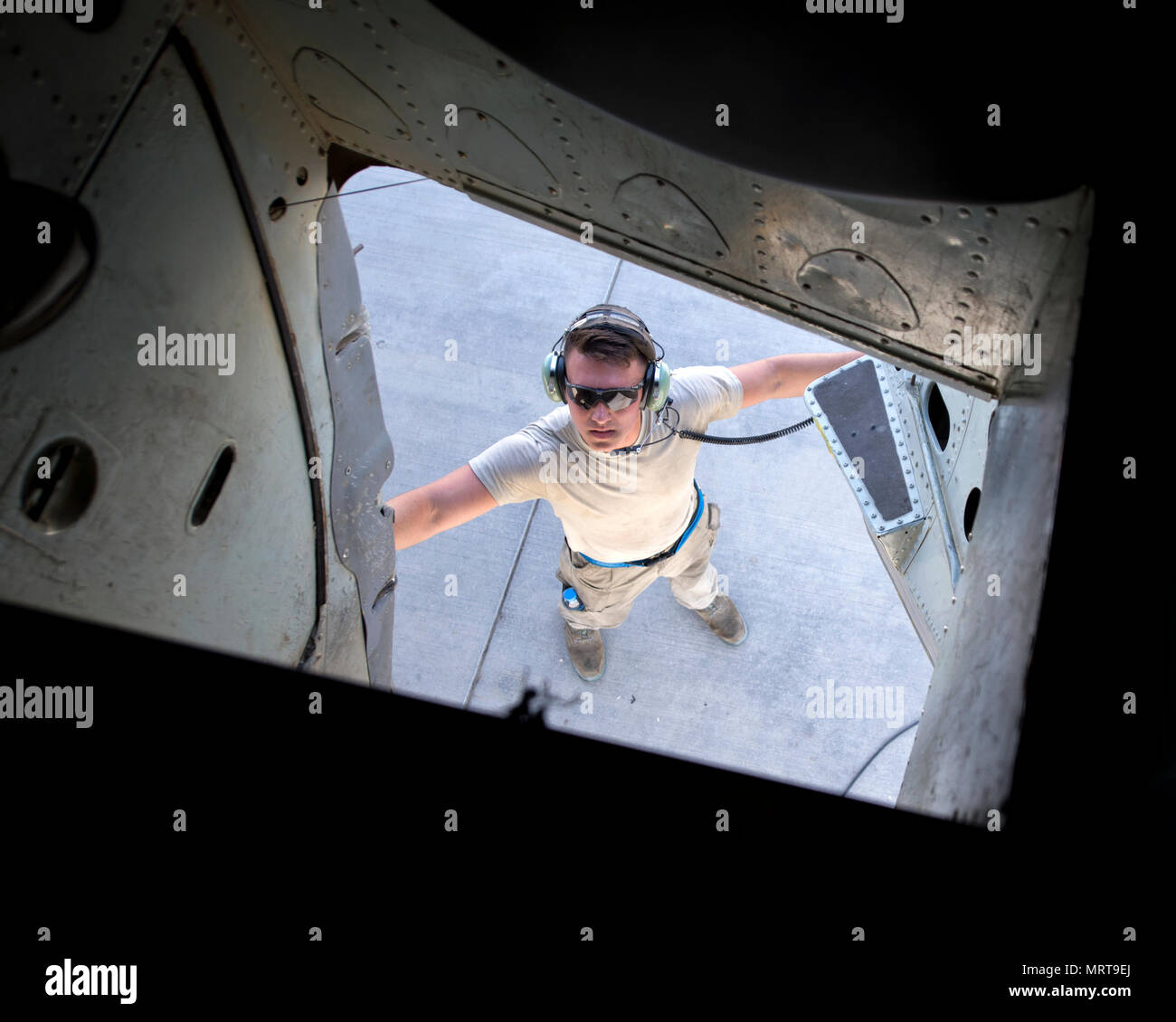 A U.S Air Force crew chief, with the 340th Expeditionary Aircraft ...