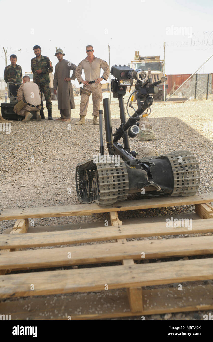 A TALON-MK2 maneuvers over an obstacle as U.S. Marines with Task Force ...