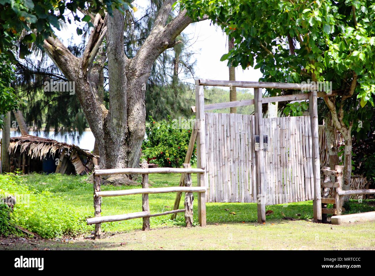 A gate made of bamboo and wood in a village in the island of Guam Stock ...