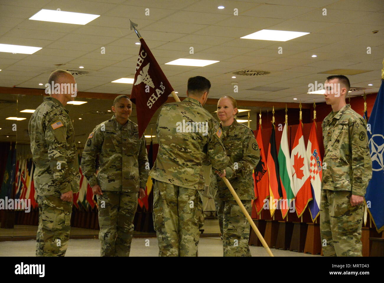 U.S. Army Col. Thomas R. Hustead (outgoing Commander), receives the ...