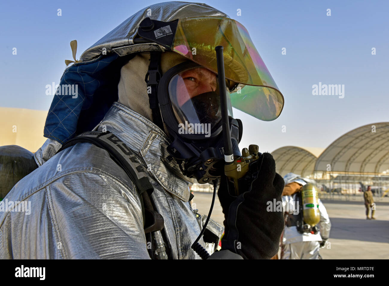 A 407th Expeditionary Civil Engineer Squadron fire department member ...