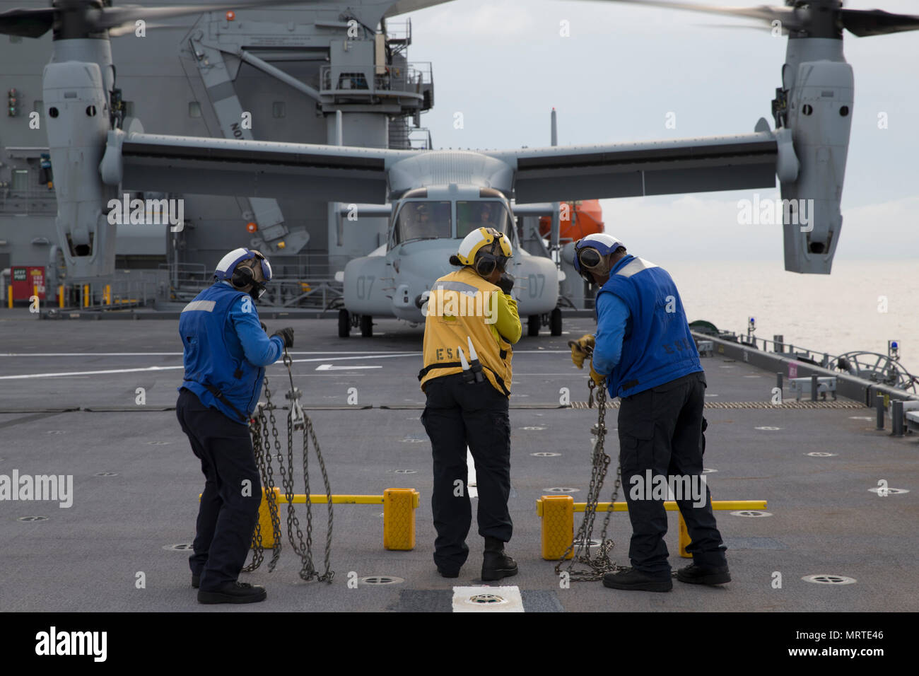 U.S. Sailors assigned to the USNS Lewis B. Puller, conduct flight-deck ...