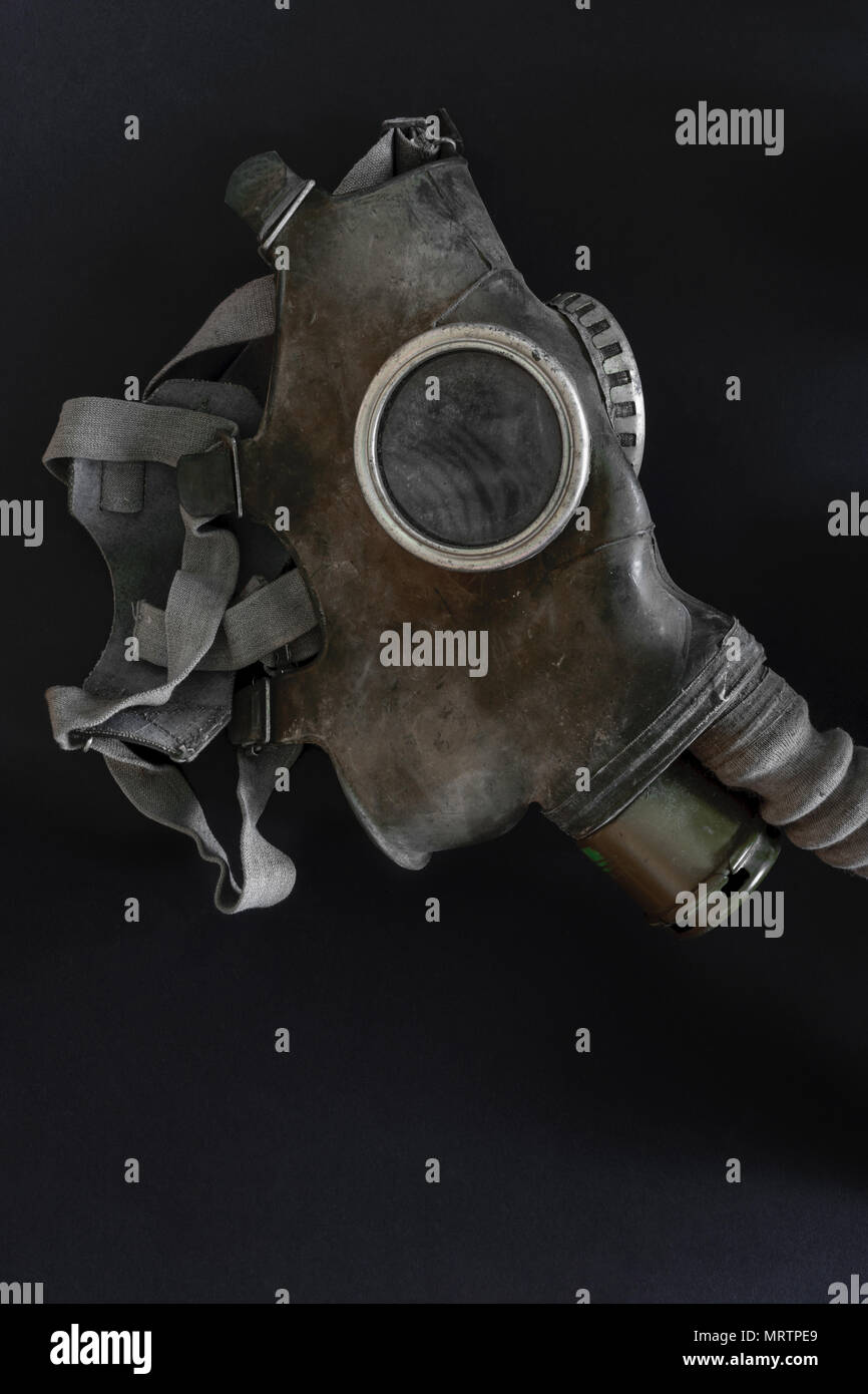 Very old gas mask on black background surface Stock Photo - Alamy