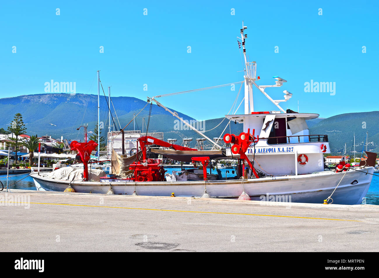 Colourful well-equipped and modern fishing boat moored in the harbour ...