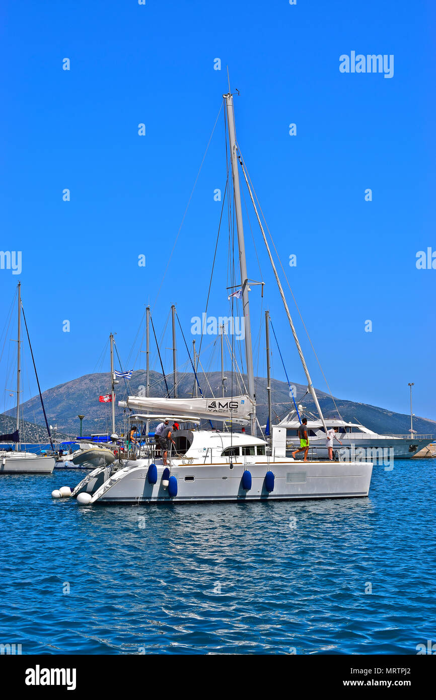 A modern catamaran departs Sami harbour on the Greek island of ...