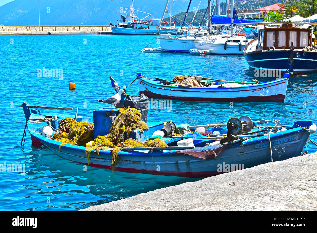 Colourful fishing boat(s) in the pretty harbour at the seaside resort ...