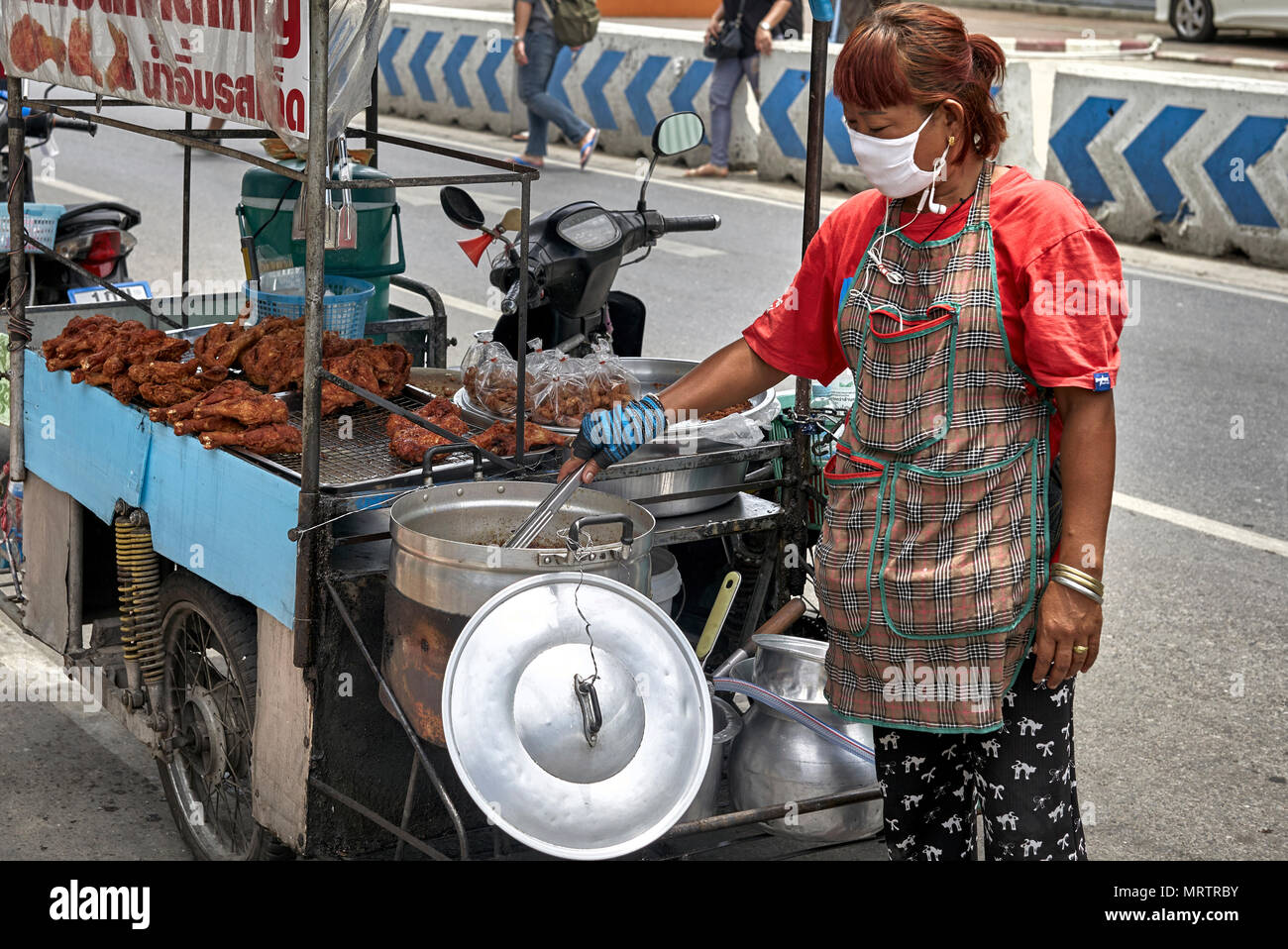 Thailand street food vendor. Woman cooking food at the kerbside Stock ...