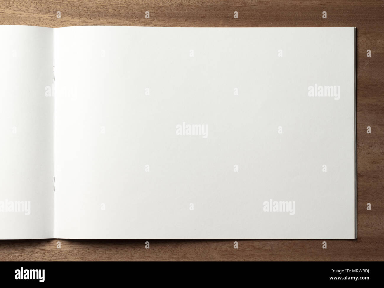 Empty sheet of sketchbook or album for drawing on wooden background ...