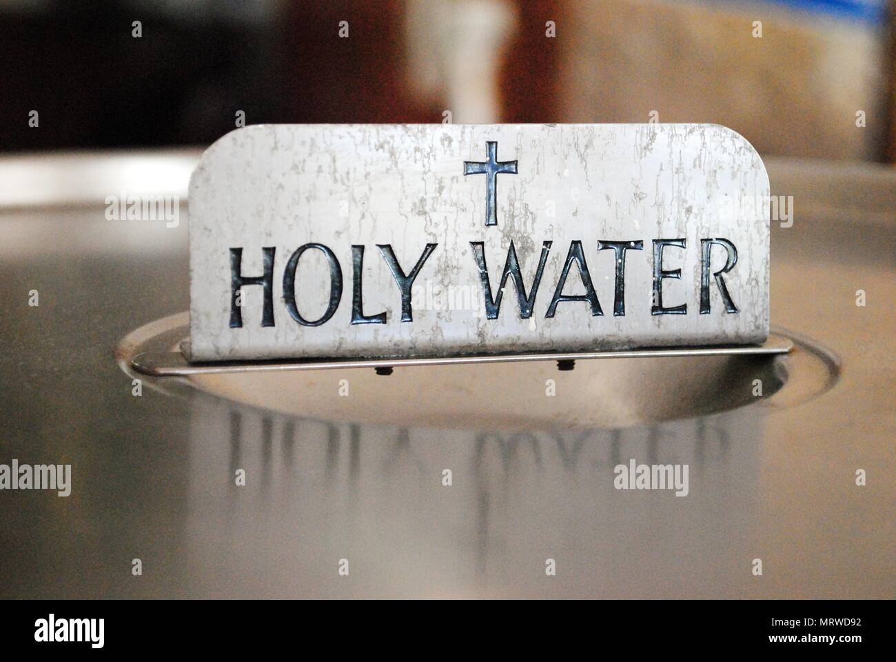 Sign for holy water in the church baptistry Stock Photo - Alamy
