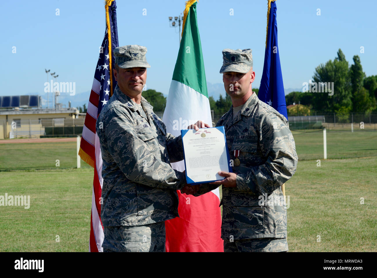On the left, U.S. Air Force Col. Matthew A. Kmon, Commander, 31st ...