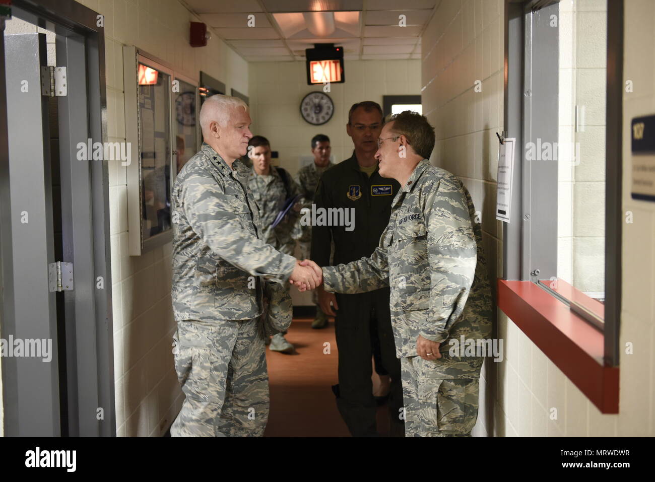 U.S. Air Force Maj. Michael J. Strohecker (right) shakes hands with Lt ...
