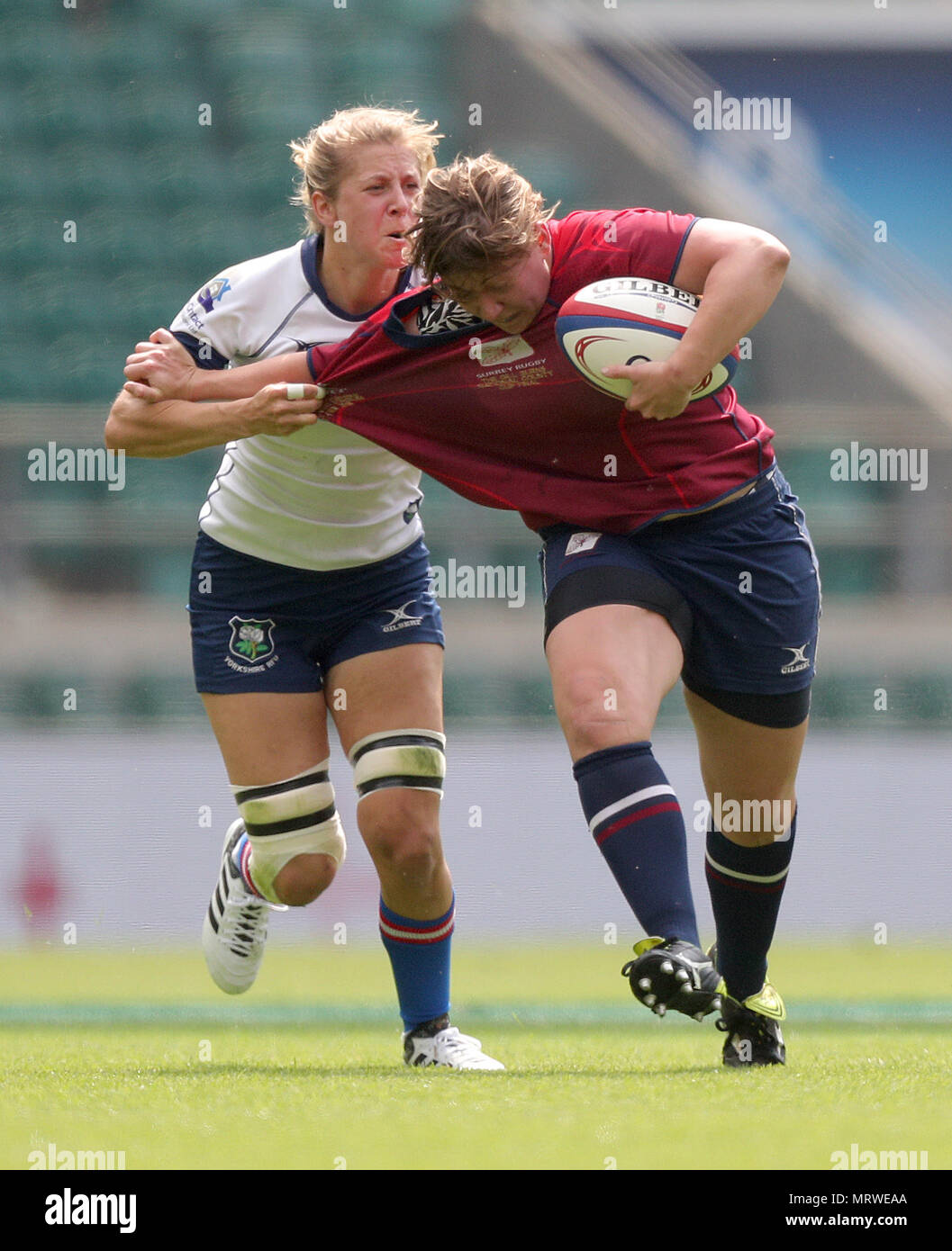 Surrey's Alice Soper (right) hands off Yorkshire's Kat Hobson during ...