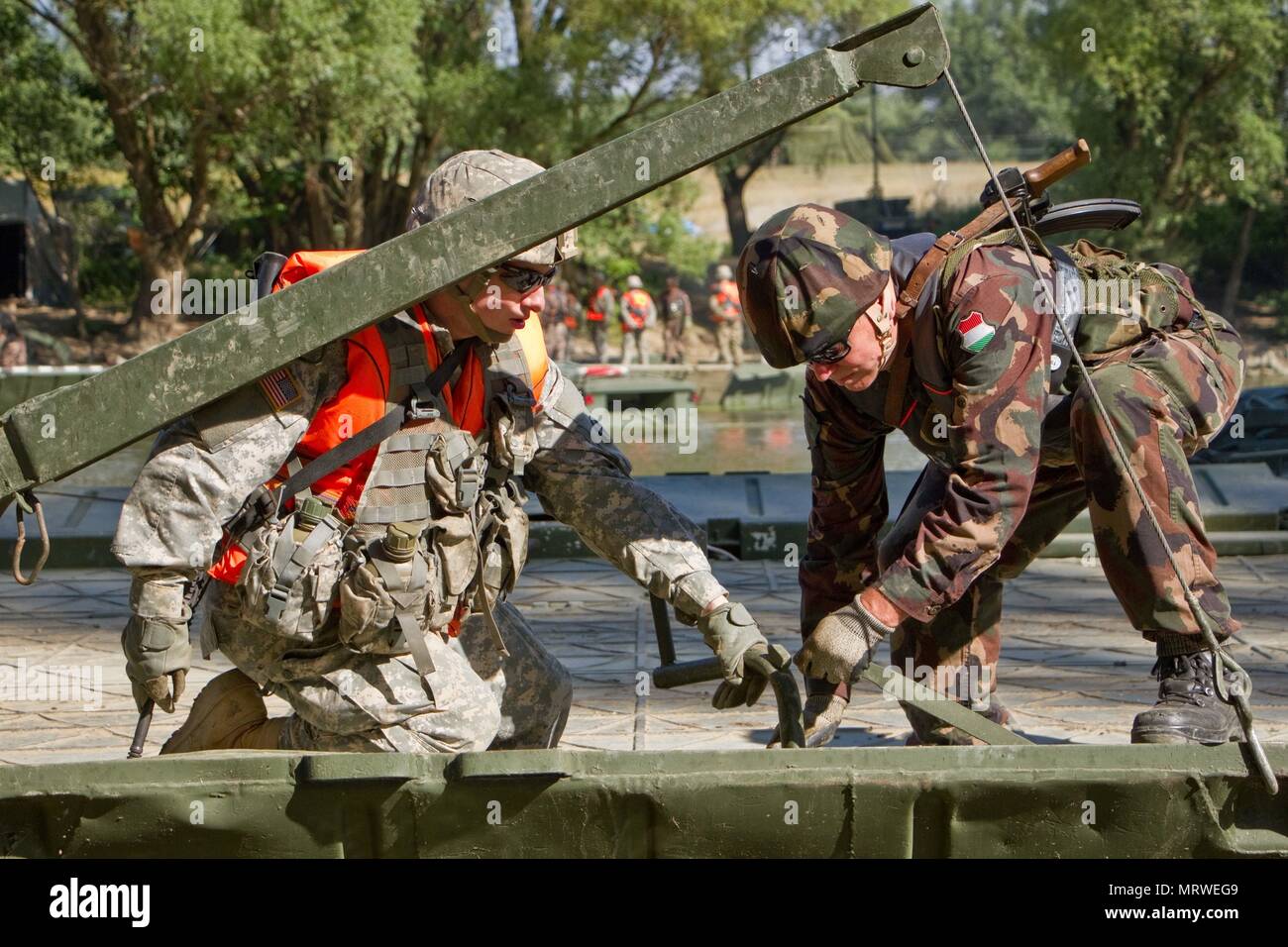 Spc. Seth Staudacher (L), a combat engineer assigned to 837th Brigade ...