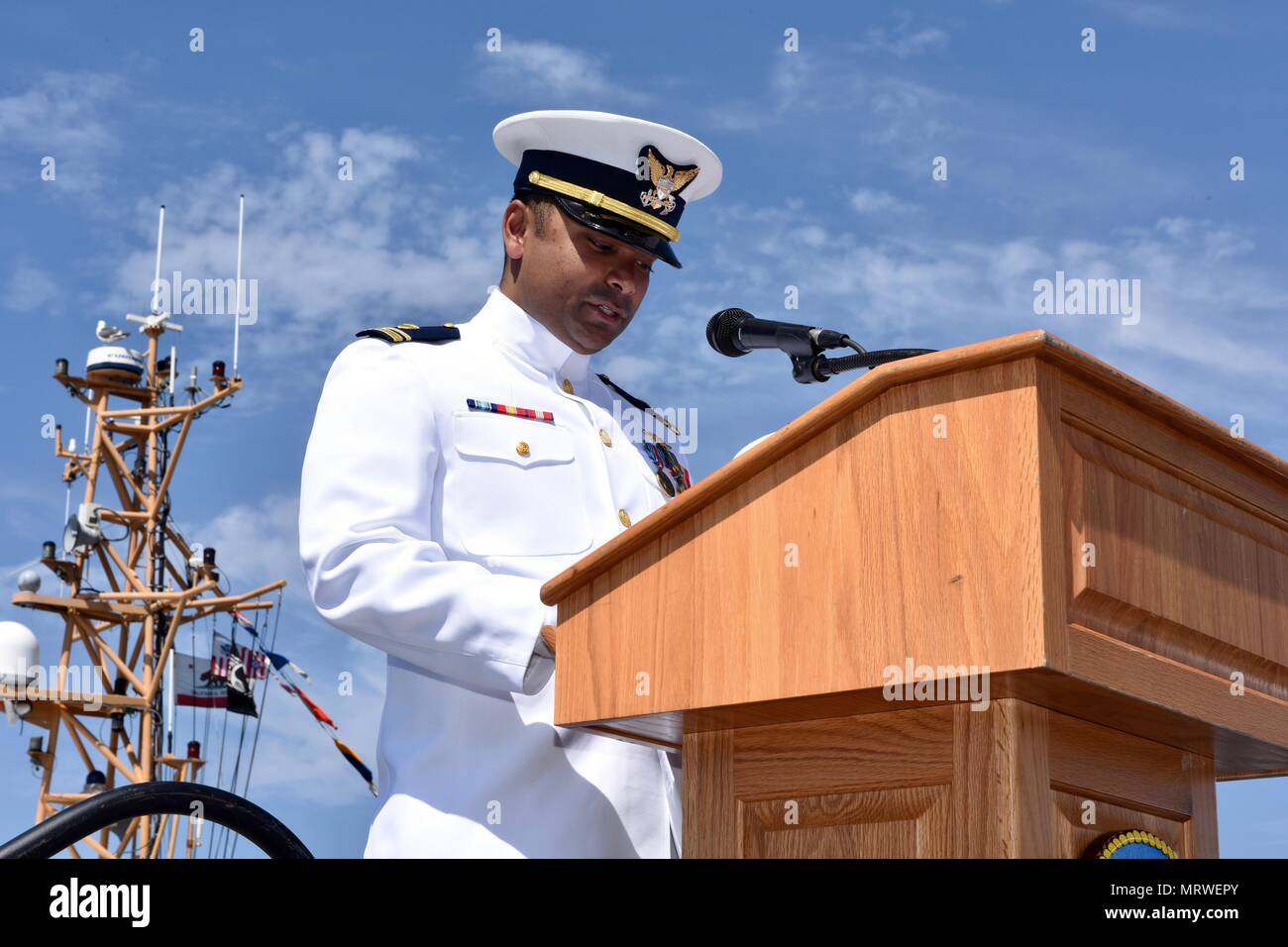Coast Guard Lt. j.g. Kumar BrunhartMcBratney delivers his remarks after ...