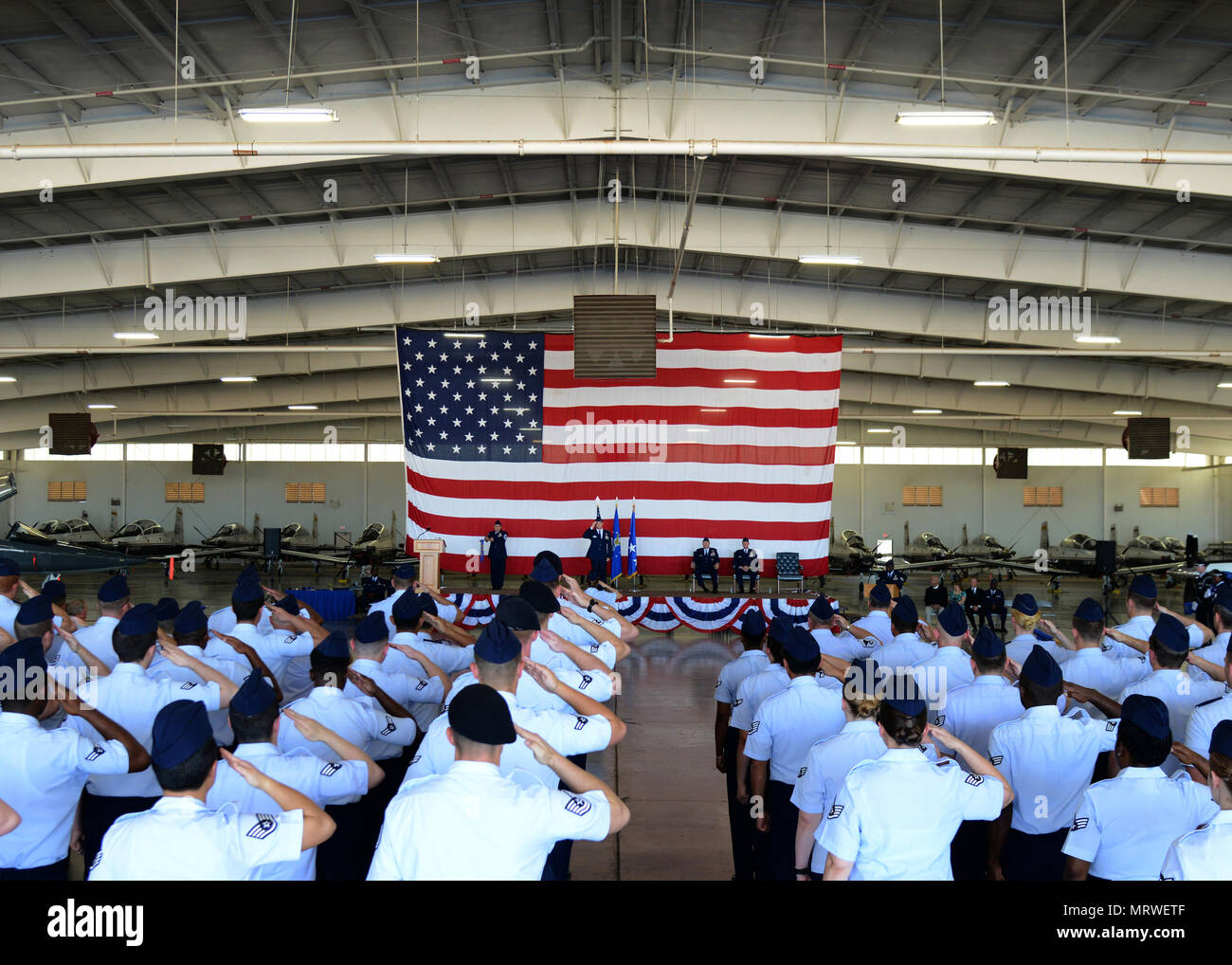 Various groups across Laughlin Air Force Base stand and render a first ...