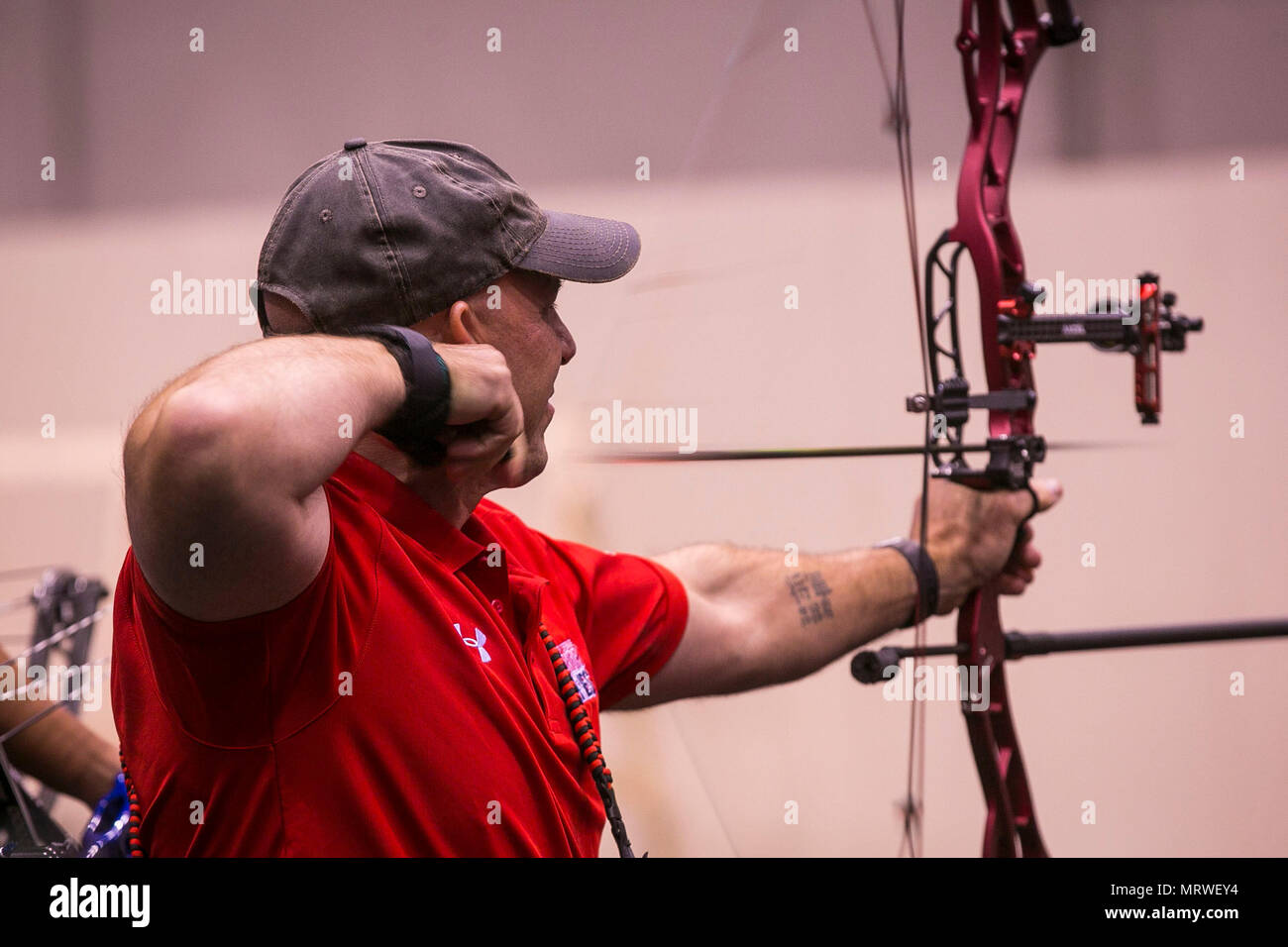 U.S. Marine Corps Gunnery Sgt. Douglas Godfrey releases an arrow during ...