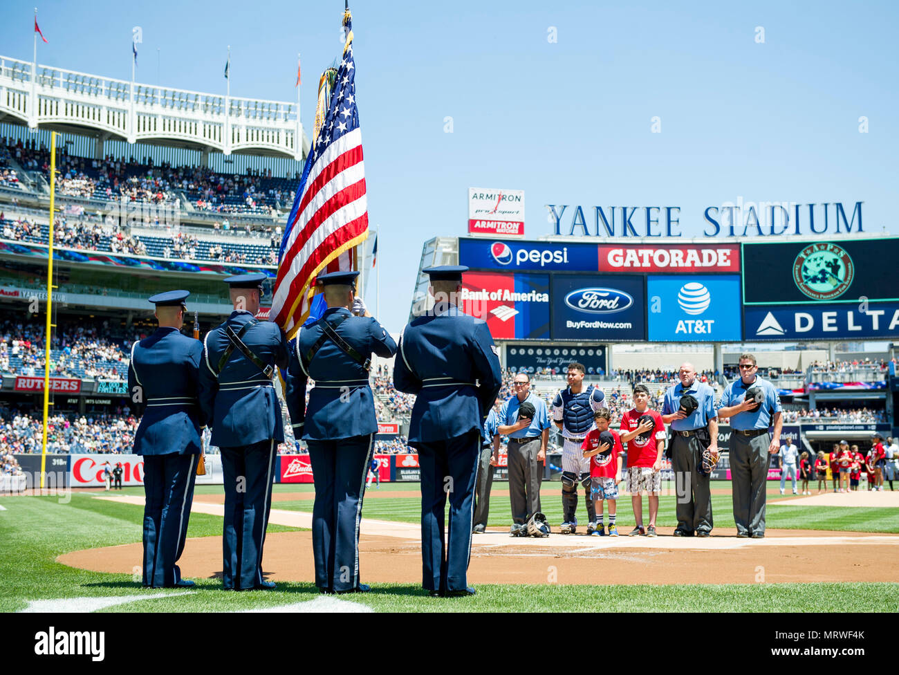 A color guard from the U.S. Air Force Honor Guard presents the colors ...