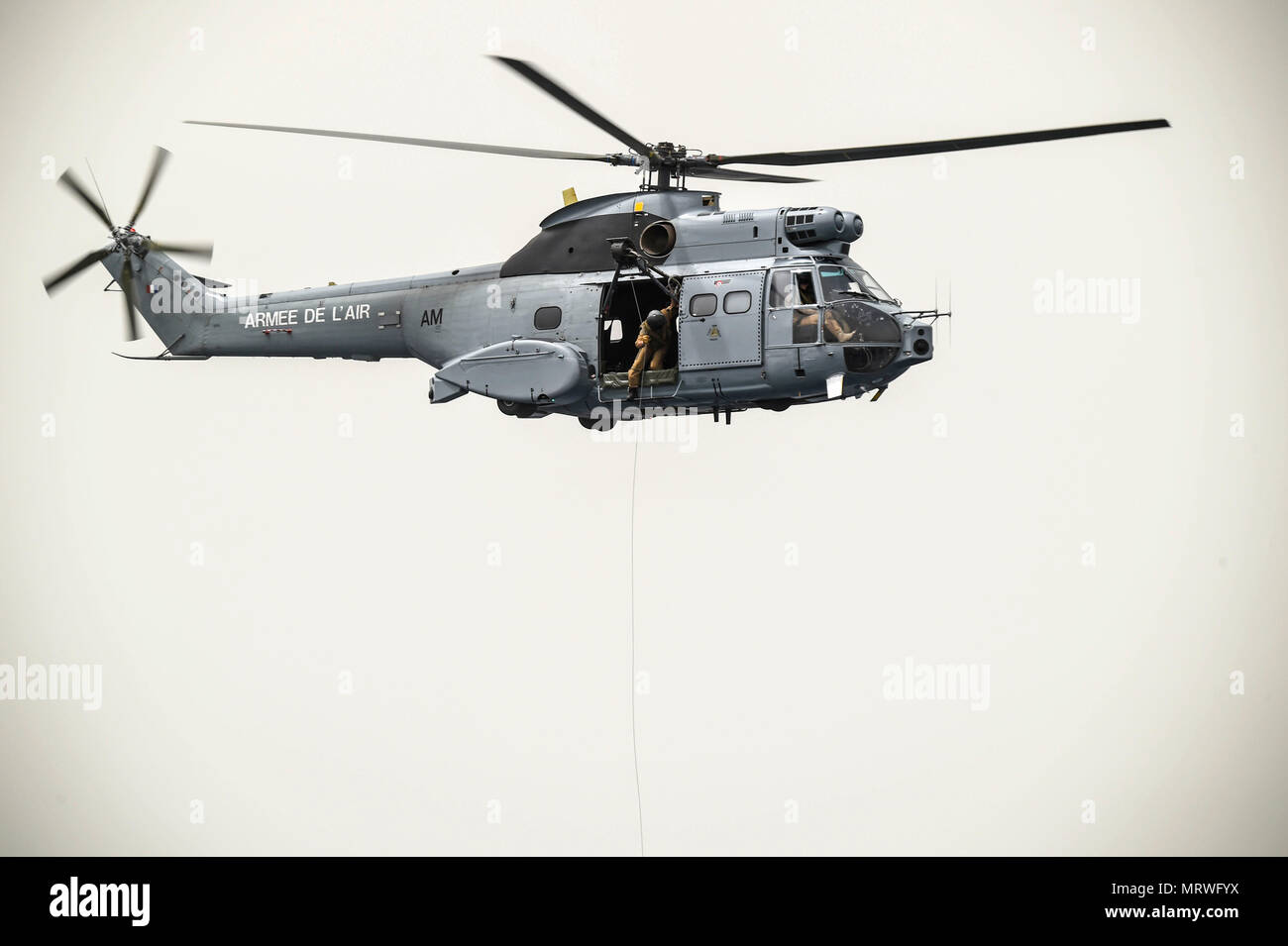 A French Air Force Aérospatiale SA 330 Puma helicopter hovers over the ...