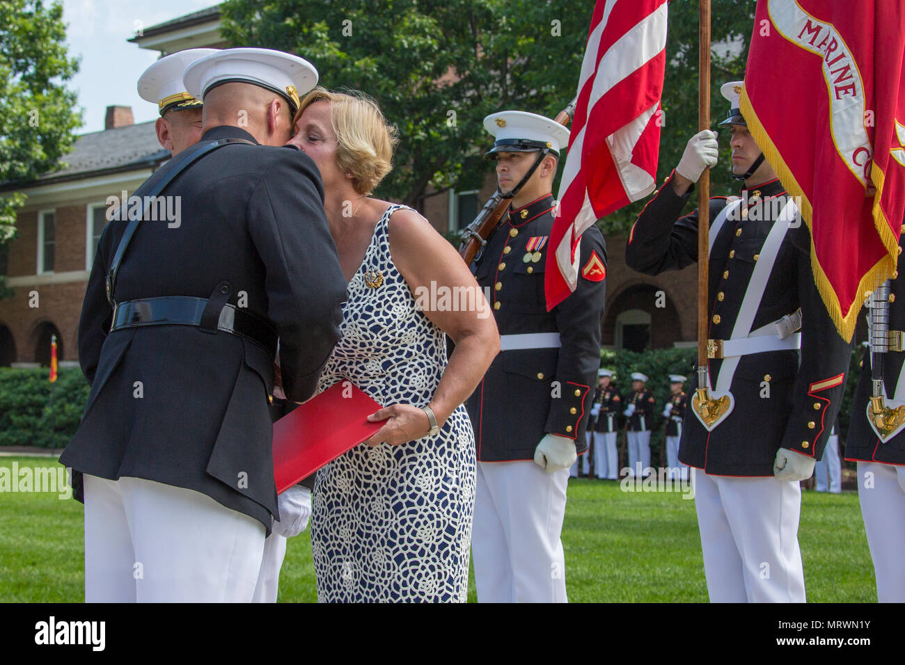 Commandant of the Marine Corps Gen. Robert B. Neller, left, hugs Carol ...