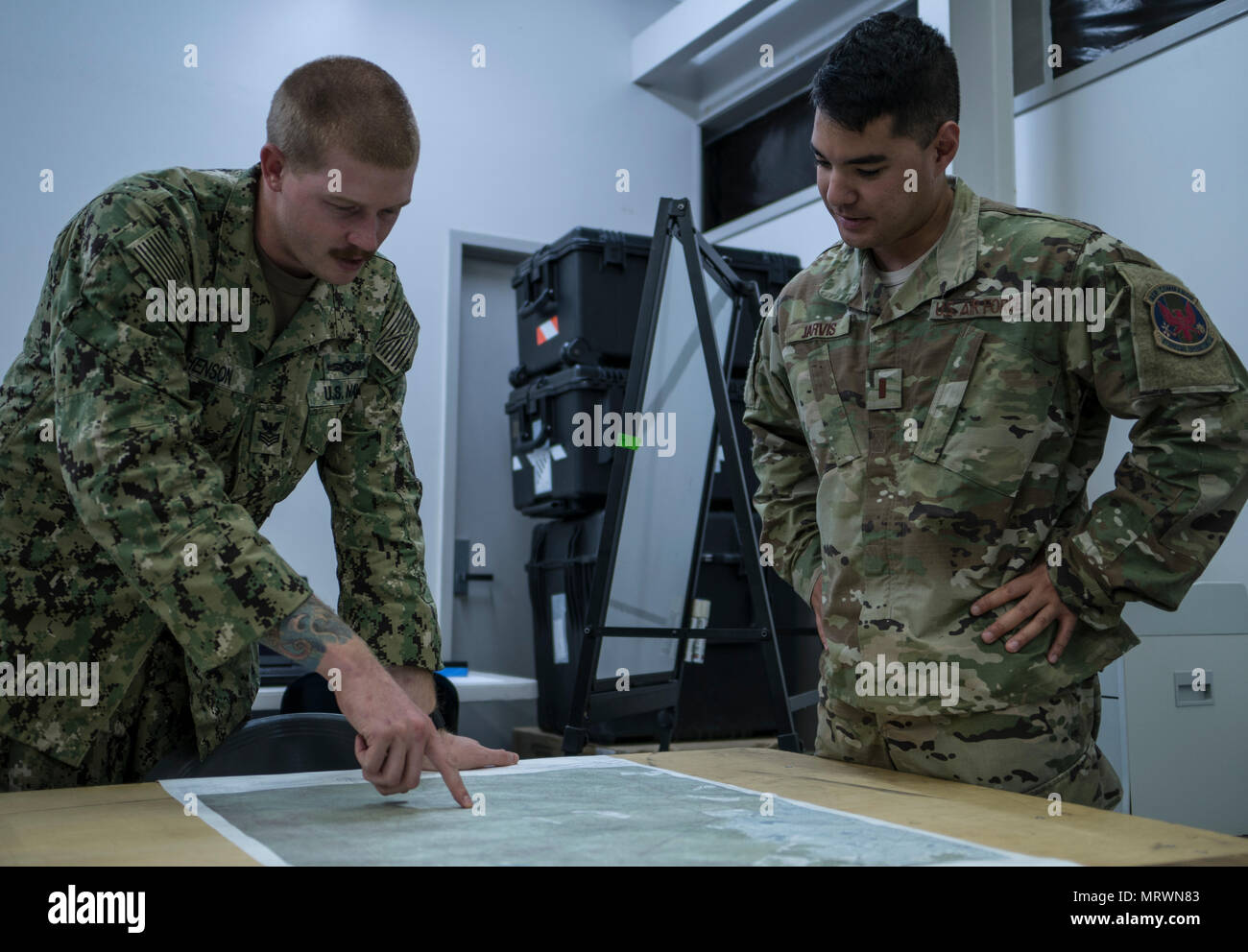 A U.S. Navy Helicopter Sea Combat Squadron-85 intelligence analyst ...