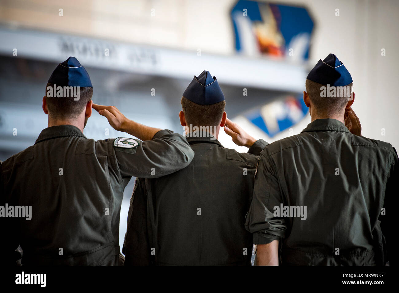 Airmen from the 41st Rescue Squadron salute during a change of command ...