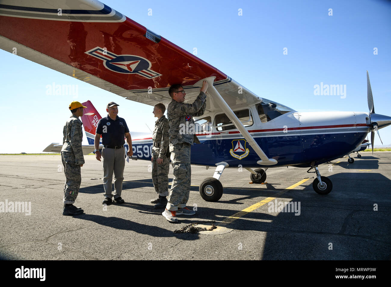 Civil Air Patrol pilot Capt. Paul Jensen performs pre-flight ...