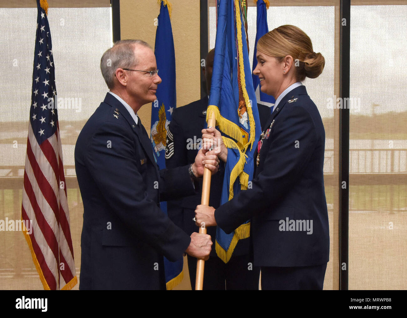 Maj. Gen. Bob LaBrutta, 2nd Air Force commander, takes the guidon from ...