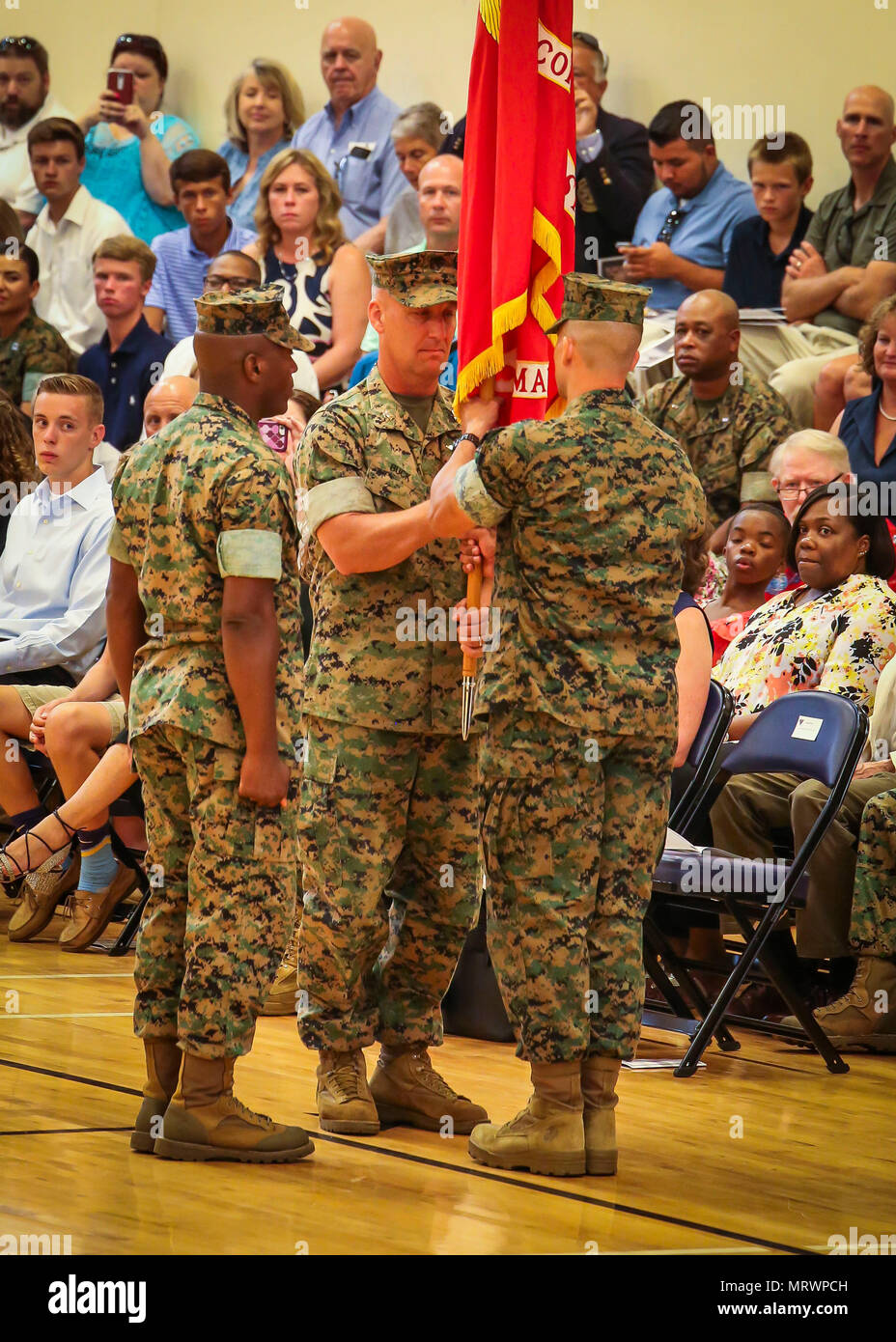 Col. Peter D. Buck (center) transfers the battle standard to Col ...