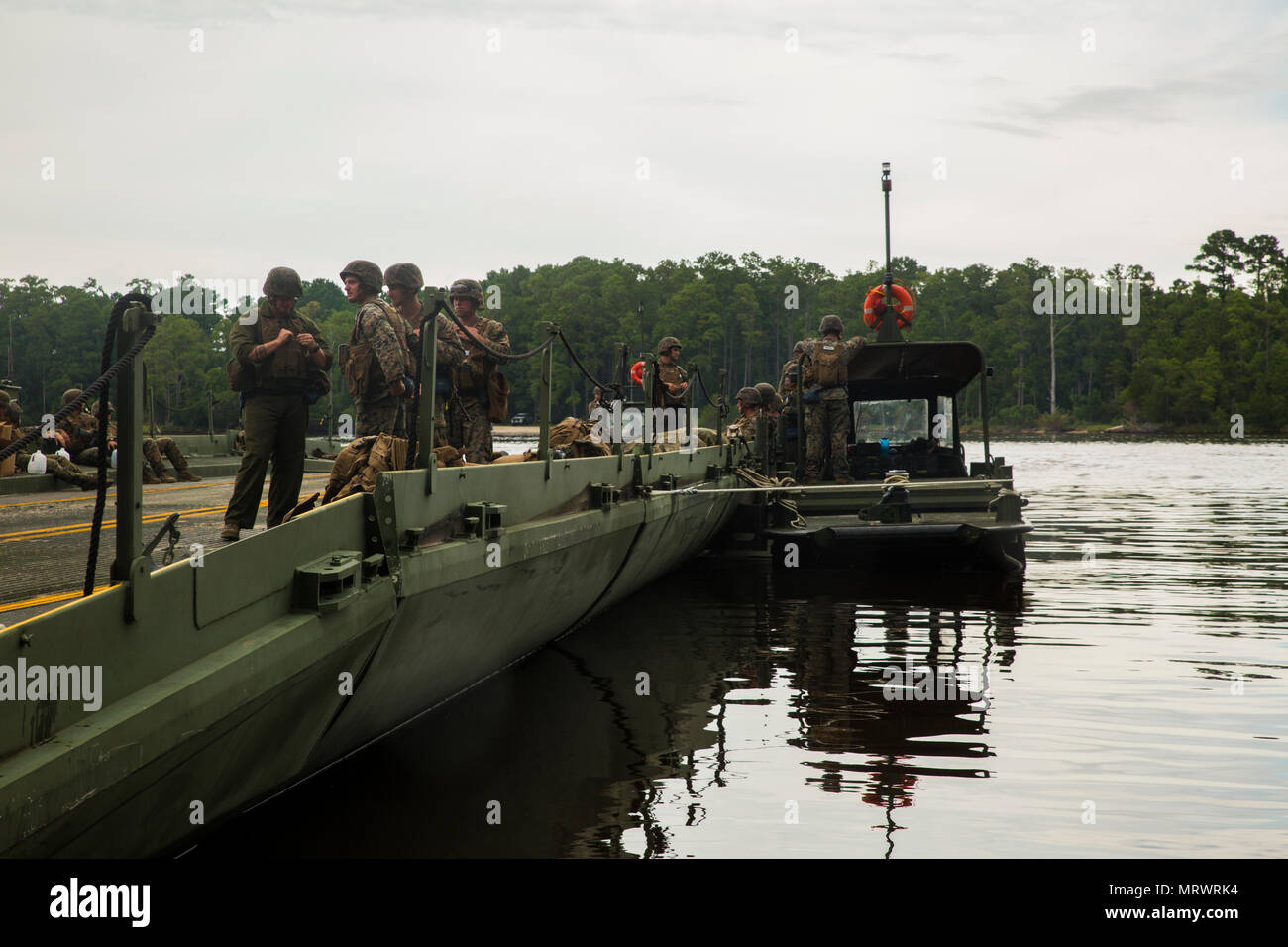 Marines prepare the seven-bay raft system to receive tactical vehicles ...