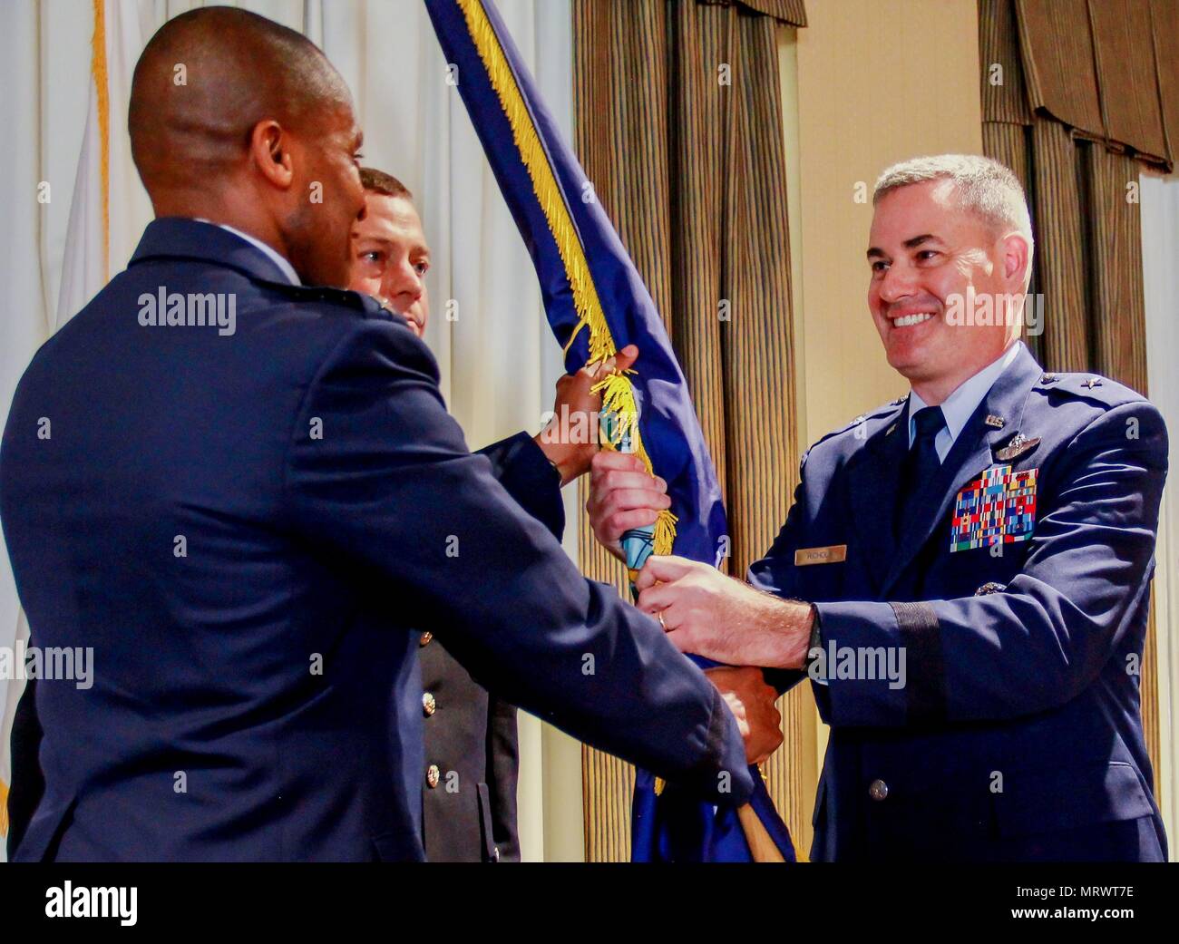 Brig. Gen. Lenny Richoux, right, accepts the unit colors from Gen ...