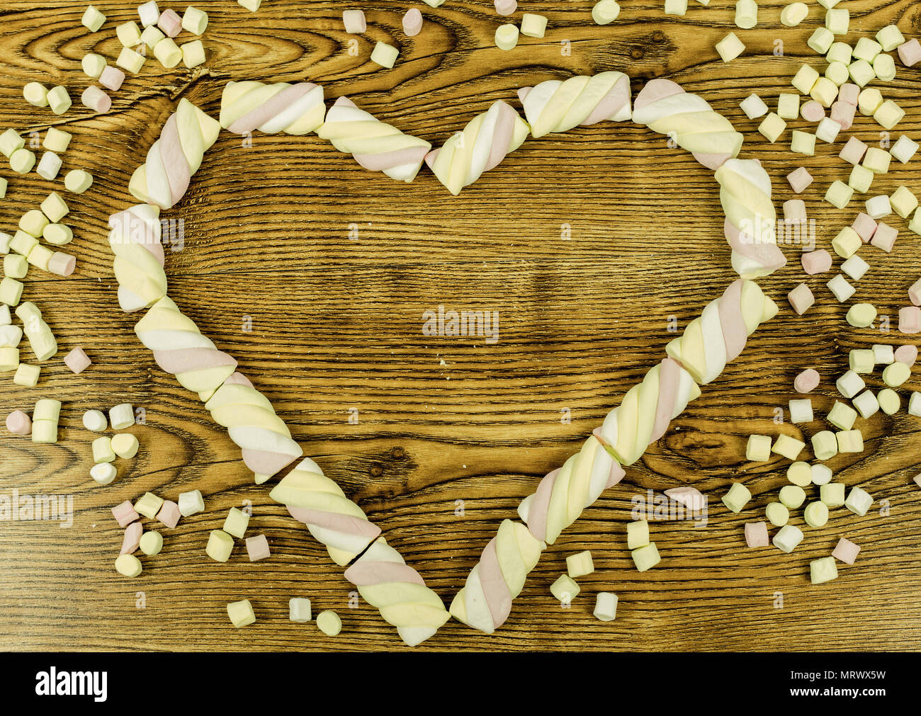 Valentines Day candy hearts marshmallows on wooden ground Stock Photo ...