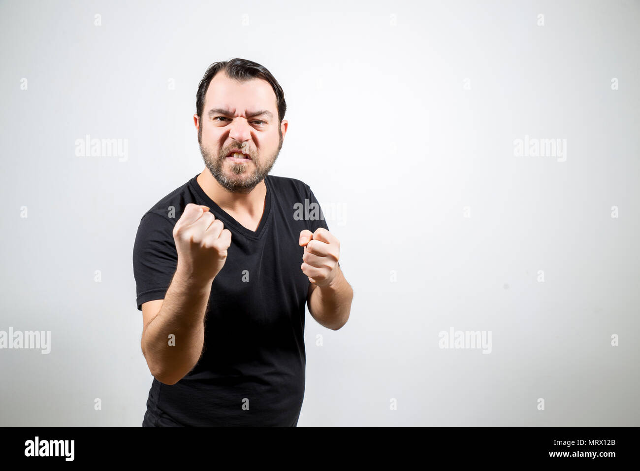 Adult man is getting ready to fight by showing his fists Stock Photo ...