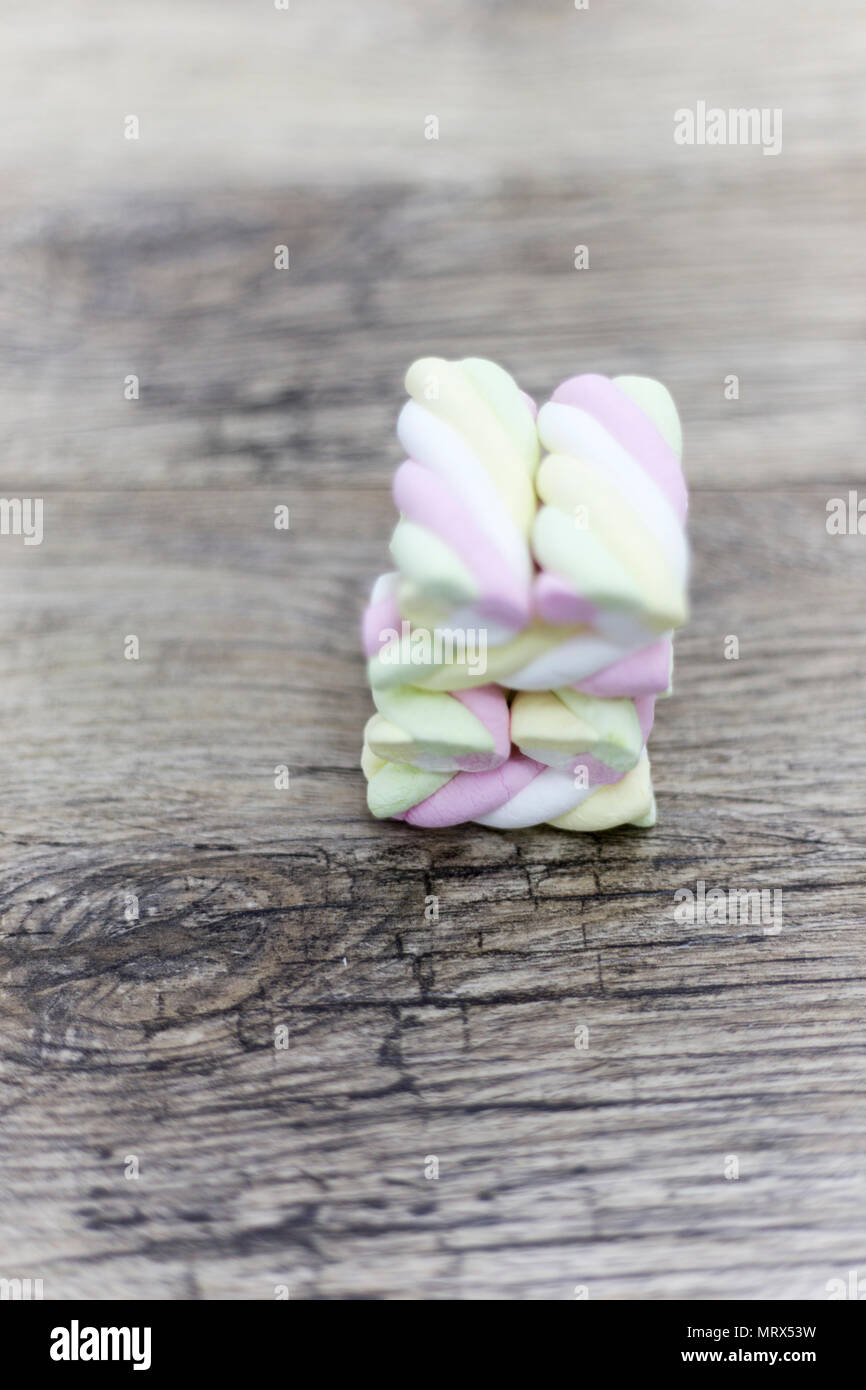 marshmallow cubes lay on dark brown wooden background Stock Photo - Alamy