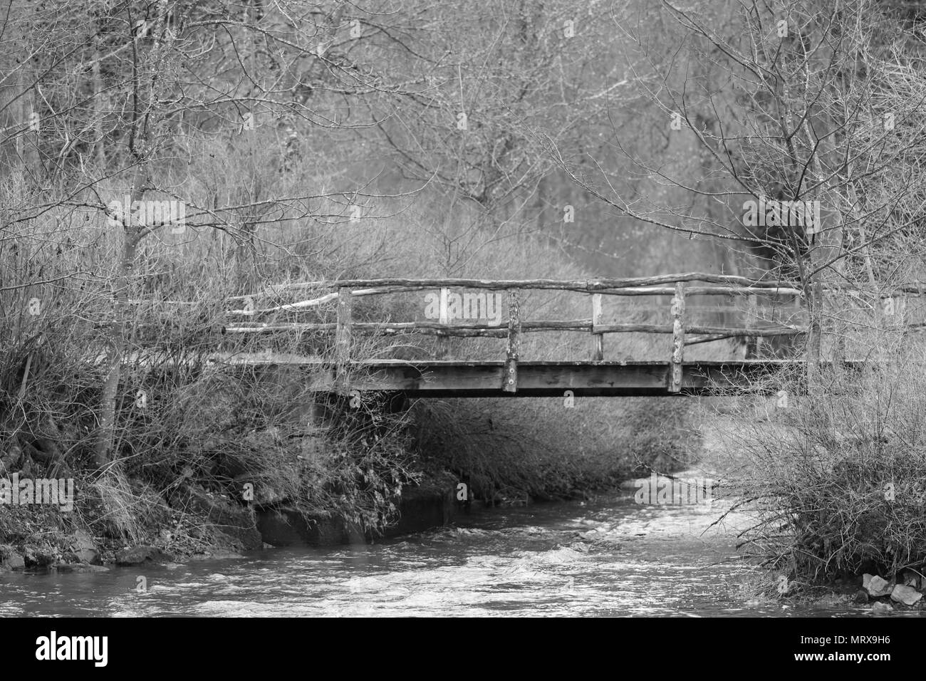 Bridge over a stream Stock Photo - Alamy