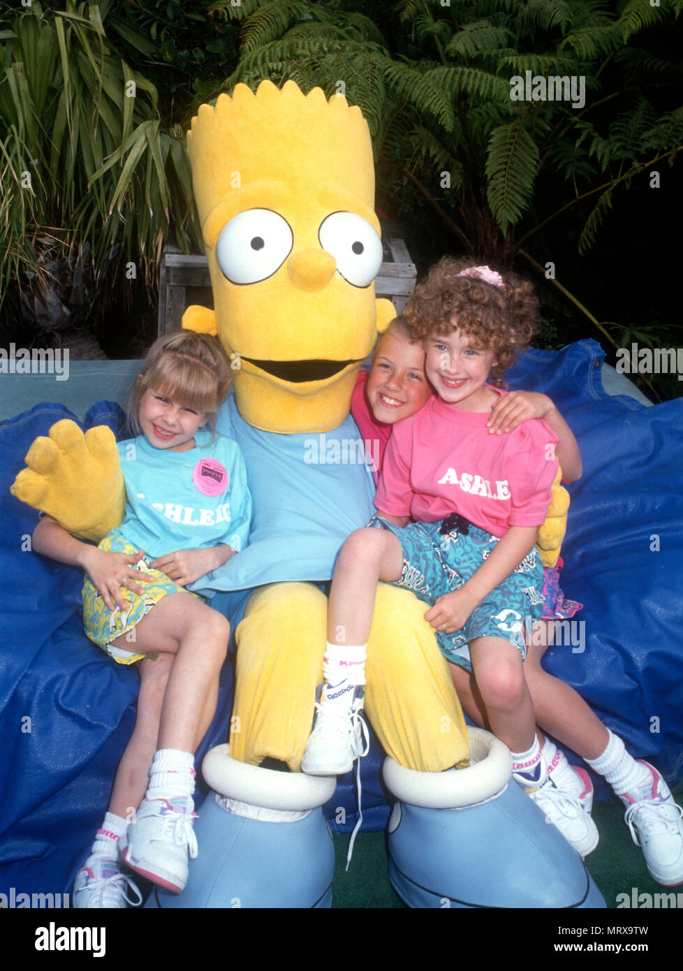 UNIVERSAL CITY, CA - APRIL 20: Actors pose with Bart Simpson at ...