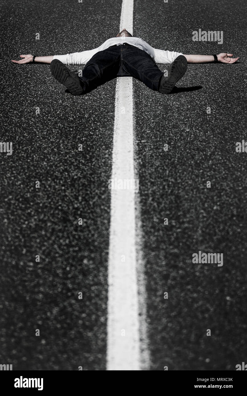 Man lying on pavement hi-res stock photography and images - Alamy
