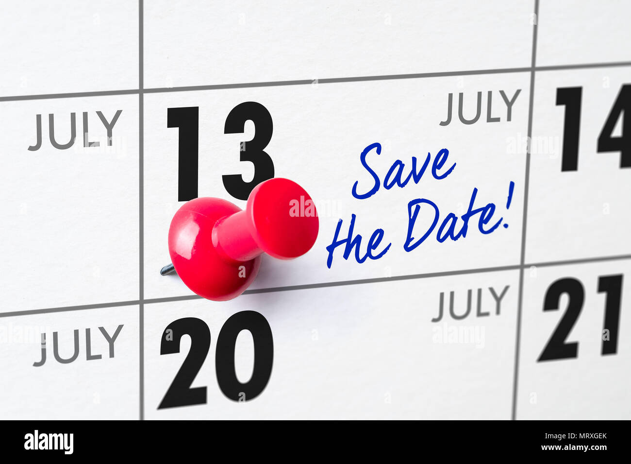 Wall calendar with a red pin - July 13 Stock Photo - Alamy