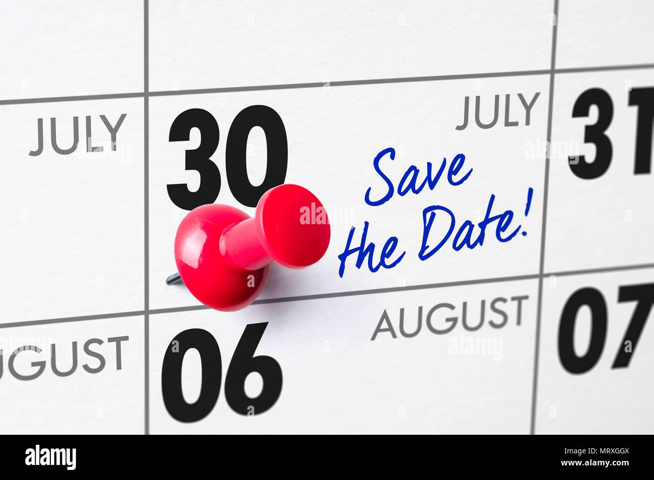 Wall calendar with a red pin - July 30 Stock Photo - Alamy
