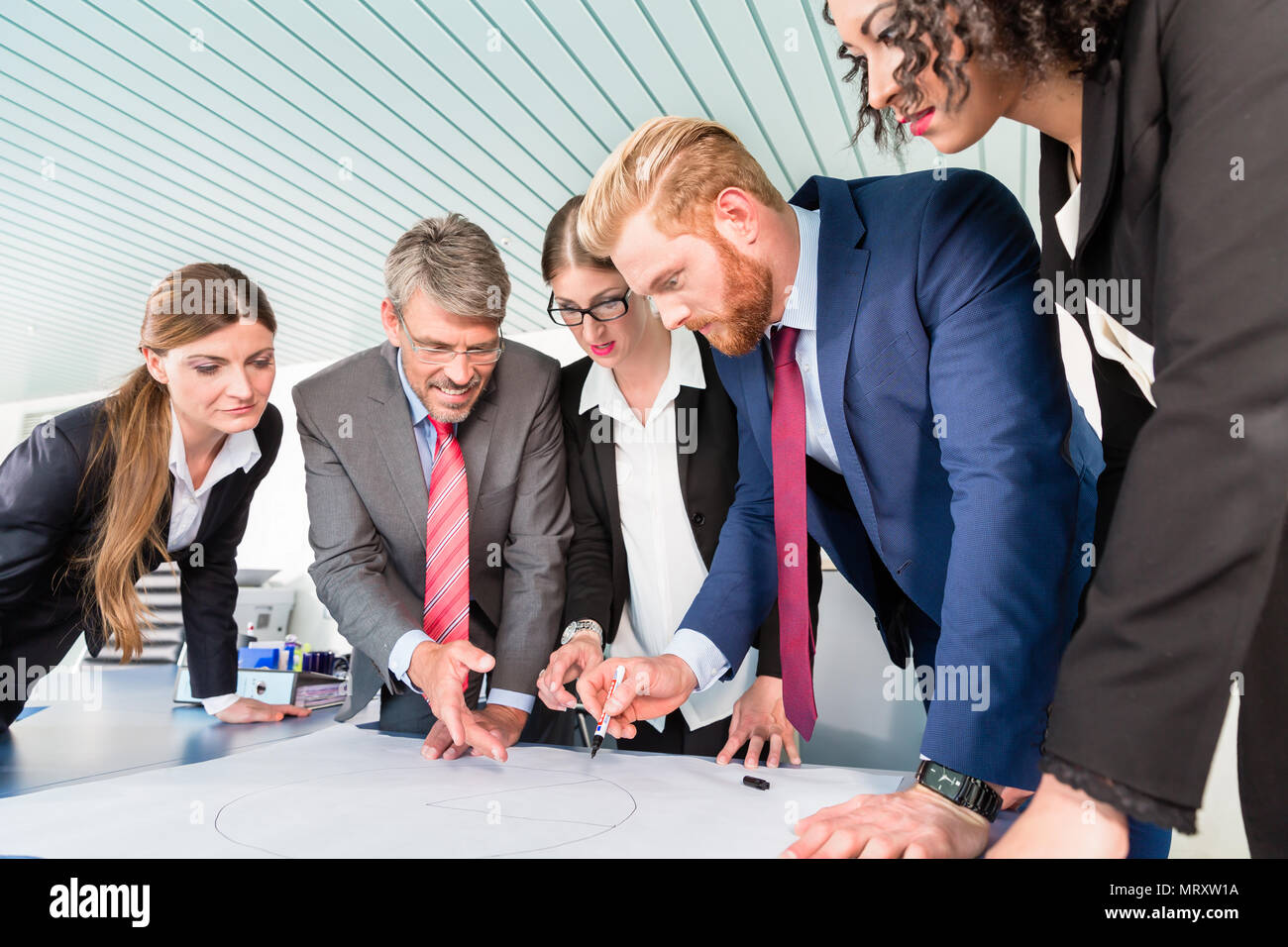 Group of business people analyzing data Stock Photo - Alamy